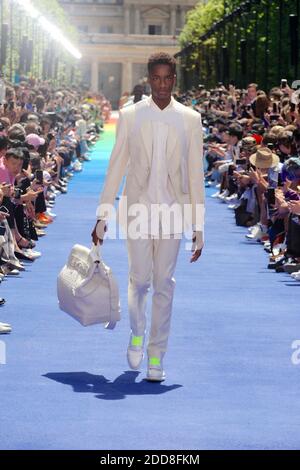 A model walks the runway at the Louis Vuitton show as part of Paris ...