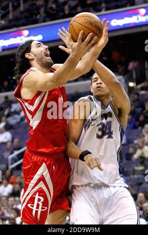 Houston Rockets' Luis Scola (4) is fouled by the Los Angeles Lakers ...