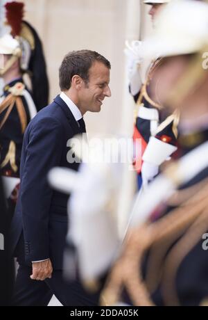 Surrounded by Republican Guards, French president Emmanuel Macron ...