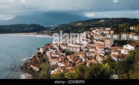 A drone shot of houses on the coast of a lake in Zahara de la Sierra ...