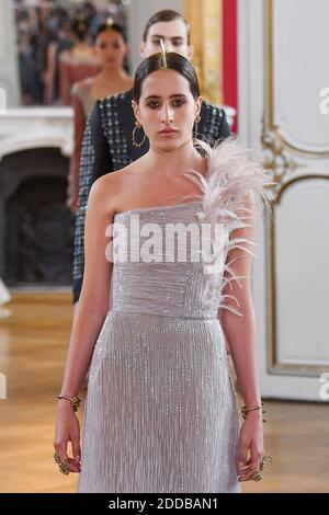 Taleedah Tamer walks the runway during Antonio Grimaldi Haute Couture ...