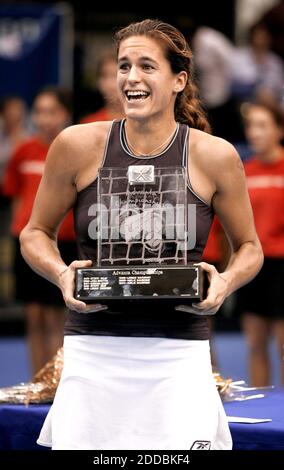 France's Amelie Mauresmo holds the Championship plate, after defeating ...