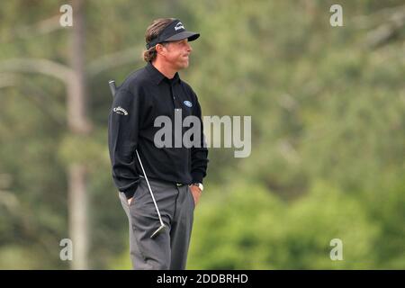 Phil Mickelson is disappointed in his putting at the 17th green during ...