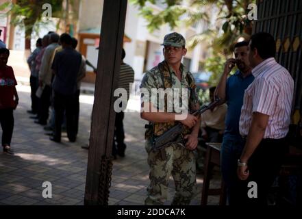 A soldier guards a polling station during the presidential runoff ...