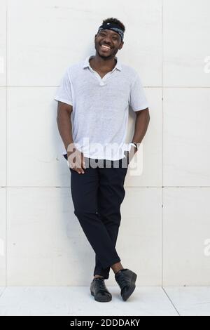 Cheerful man in a white t-shirt mocap poster discount advertising copy ...