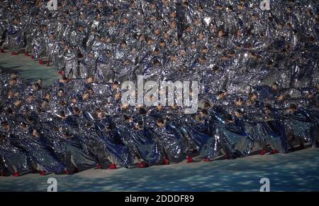 Performers in mirrored costumes flow through Fisht Stadium during the ...