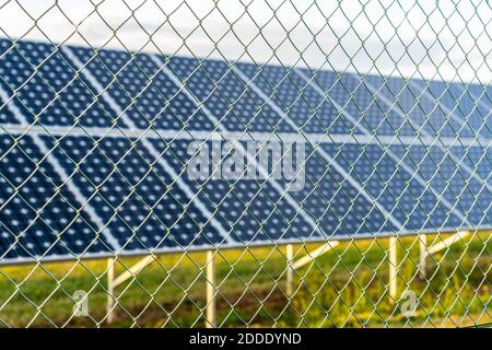 Solar fence system with photovoltaic panels to power an electric fence ...