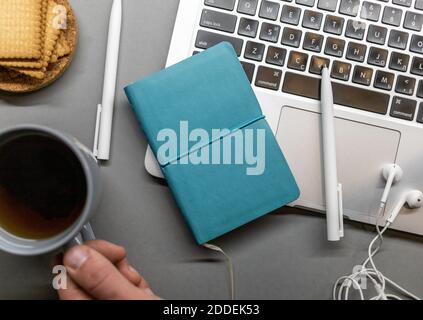 Notebook and headphones on a blue surface - copy spac Stock Photo - Alamy
