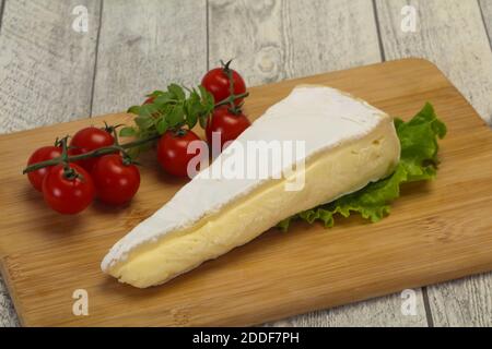 Brie cheese triangle served salad leaves Stock Photo - Alamy