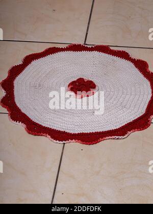 Red crochet rug handmade with little use Stock Photo - Alamy