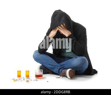 Male junkie with drugs and alcohol on white background Stock Photo - Alamy