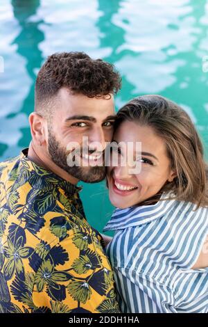 Young couple wearing casual clothes standing together with sad ...