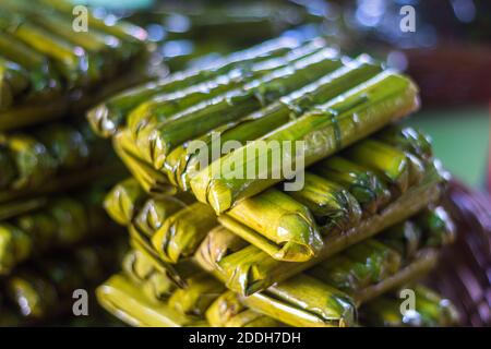 Rice cakes called 'budbud' or suman' wrapped in blanched banana leaves ...