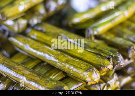 Rice cakes called 'budbud' or suman' wrapped in blanched banana leaves ...