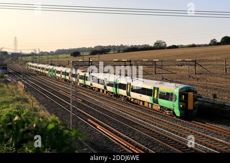 A Southern Railways main line electric train passing through Raynes ...