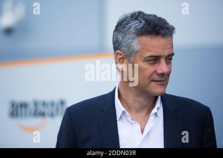 Director general of Amazon France Frederic Duval and French Minister of ...