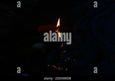 Ugly man with burning flambeau walking in a dark tunnel Stock Photo - Alamy