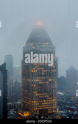 Aerial View of an Illuminated Triangle Shaped Tower Top in Manhattan ...