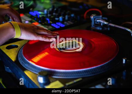 Hip hop dj scratches vinyl records on turntable player.Professional ...
