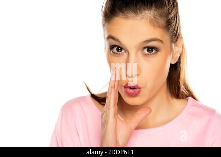 portrait of young beautiful woman, whispers on white background Stock ...