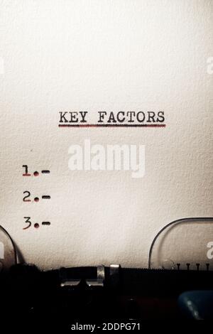 Key factors phrase written with a typewriter Stock Photo - Alamy