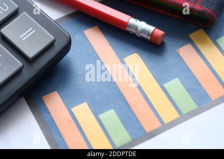 financial graph, calculator and notepad on table Stock Photo - Alamy