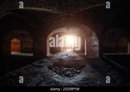 Dark and creepy vaulted red brick dungeon Stock Photo - Alamy