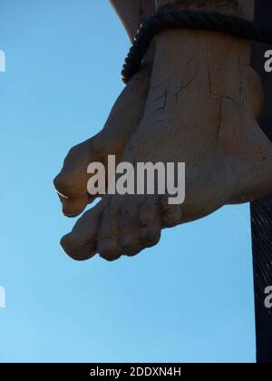 stone feet of a statue, barefoot, clear blue sky background Stock Photo ...