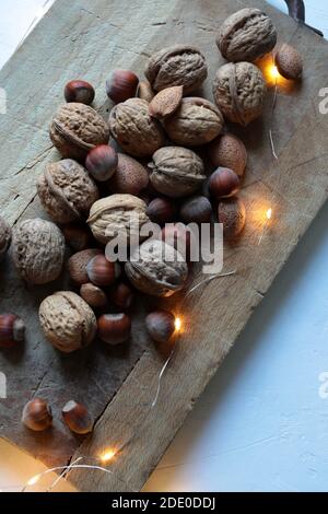 Detail of christmas tree with walnut on the table Stock Photo - Alamy