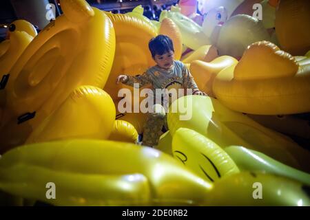Boy with inflatable duck Stock Photo - Alamy