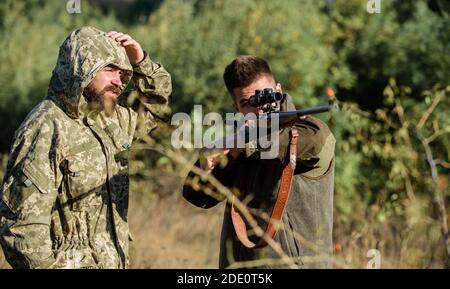 Hunters poachers looking for victim. Hunters with rifles in nature ...