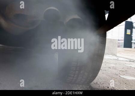 Air pollution and particulates caused by car exhaust gases, cloud of ...