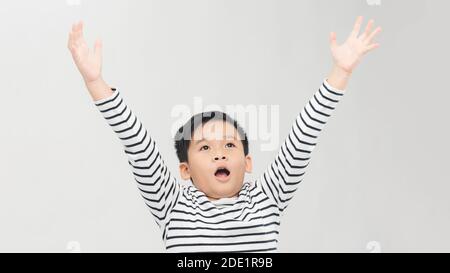 Vietnamese teen boy raised his hand and shows victory sign . Raised two ...