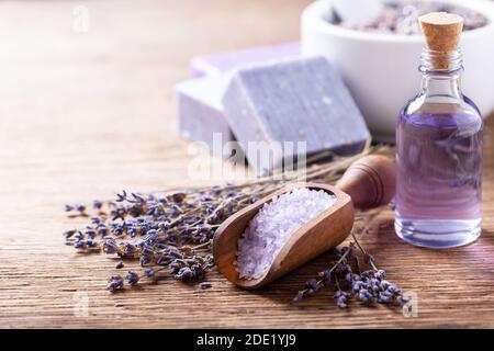 Lavender's spa products with dried lavender flowers on pink background ...