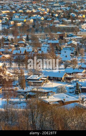 Aerial view of a detached house with snowy photovoltaic cells on the ...