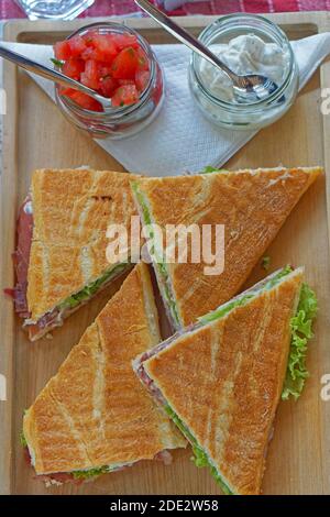 Diagonally cut triangular toast sandwiches Stock Photo - Alamy