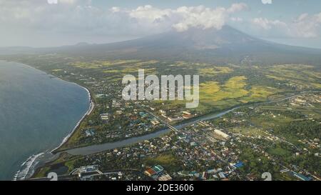 Mayon volcano eruption aerial view: cloudy smoke haze and greenery ...