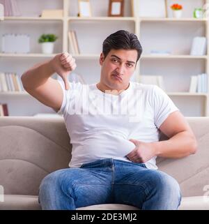 Fat man holding excessive fat belly, overweight fatty belly isolated on ...