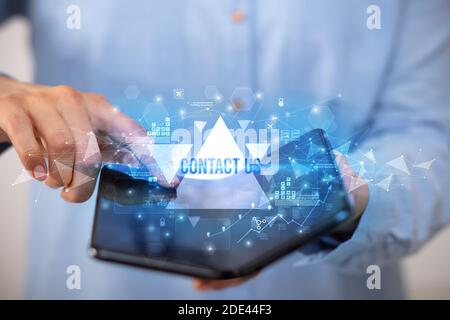 Businessman holding a foldable smartphone, business concept Stock Photo ...