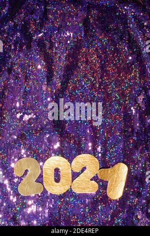 2021 new year symbol. The number '2021' on wooden cubes. Two metalic ...