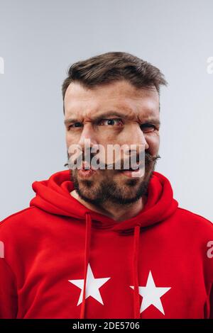 Asking, wondered. Young man with dual emotions combination on face ...