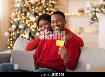 New Year, online shopping and christmas concept. Happy bearded man ...