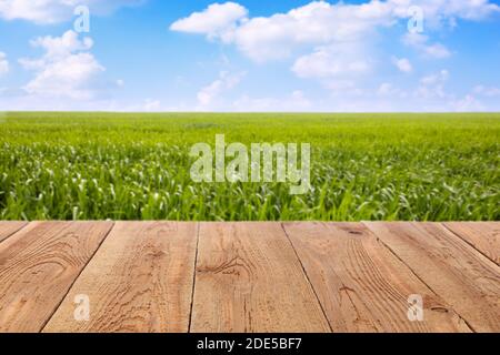 Empty wooden table and blue summer sunset in background Stock Photo - Alamy