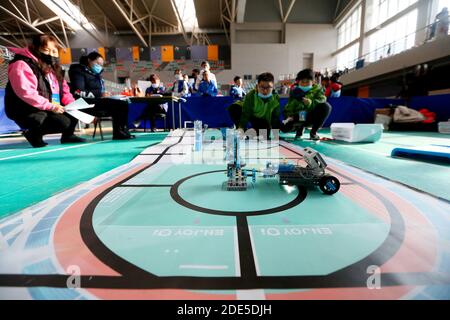 Students participate in a robotics competition during STEM Day at ...