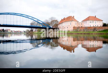 Hoya, Germany. 29th Nov, 2020. The former count's castle is reflected ...