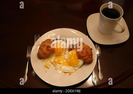 It looks like an open face sandwich; the toasted croissant was sliced ...