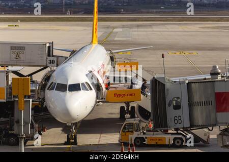 Airbus A320 type airliner parked in service area with ambulift ...