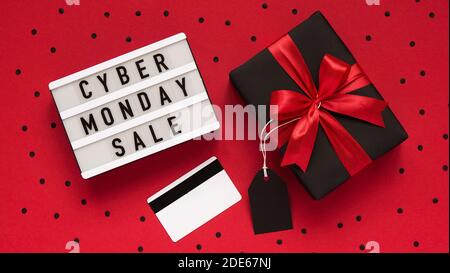Cyber Monday Sale. Gift box with ribbon bow and computer laptop on ...
