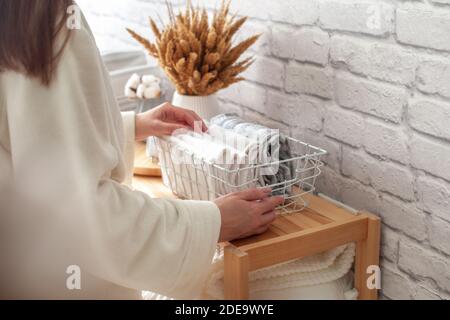 Woman beautifully put things into containers Stock Photo - Alamy