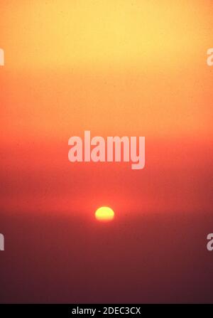 SUNSET SEEN THROUGH SMOG Stock Photo - Alamy